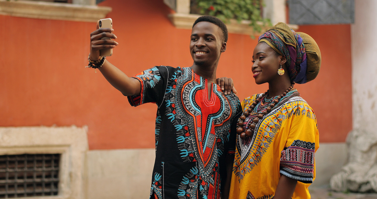 African young stylish and attractive couple in traditional outfits ...